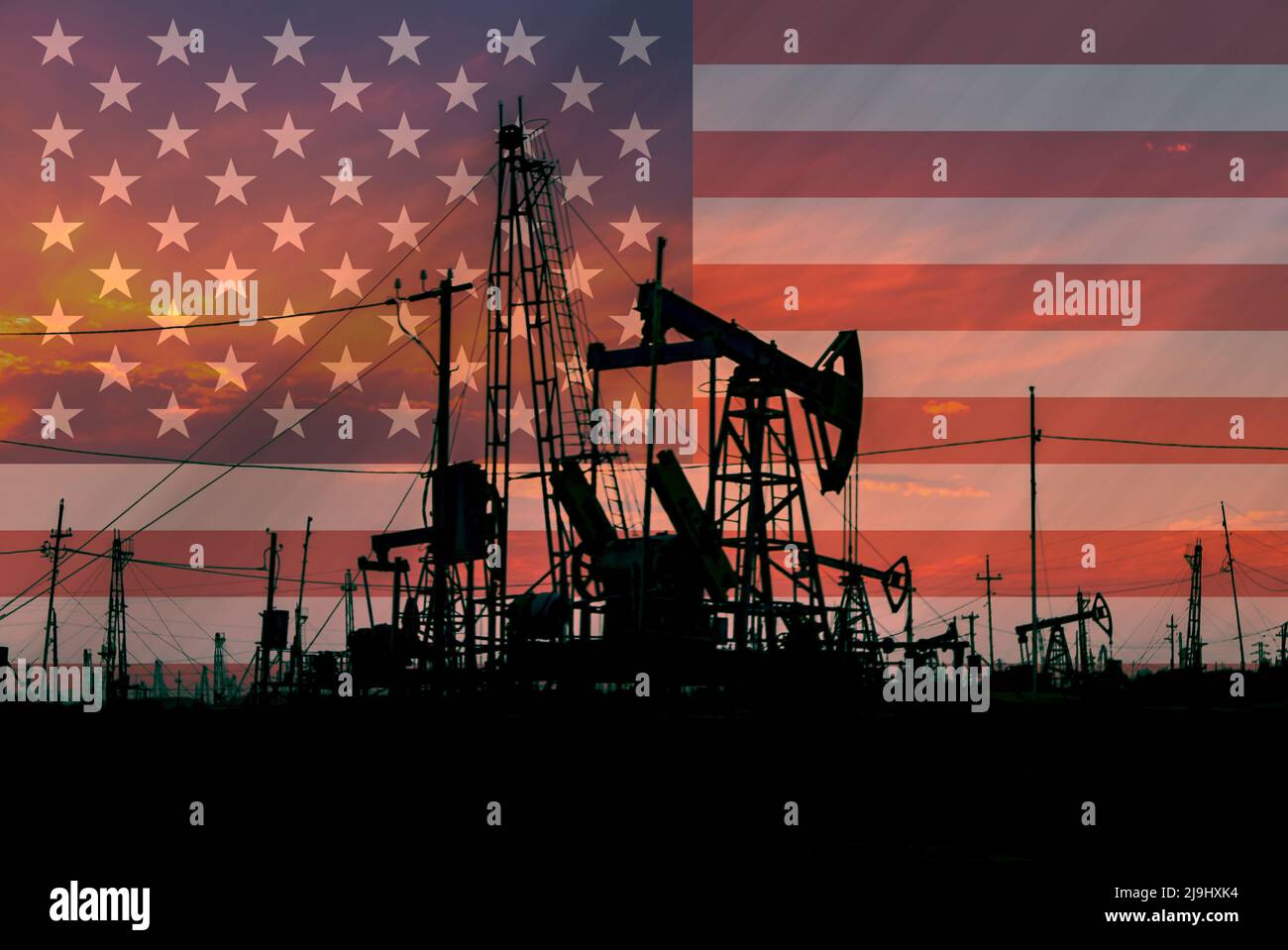 American flag in background of oil wells and rigs Stock Photo - Alamy