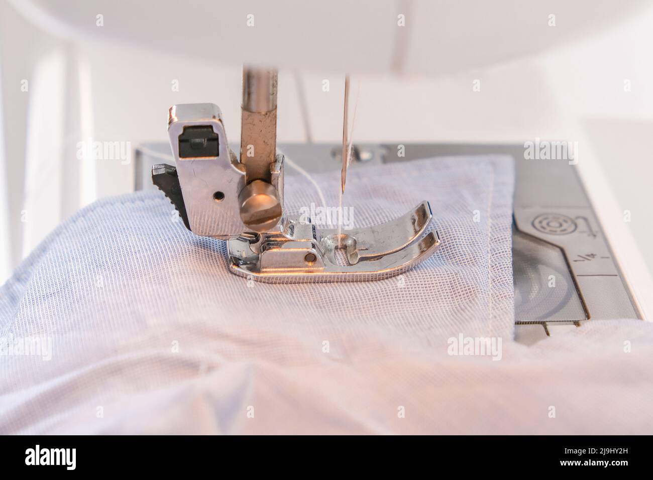 Man sews on vintage sewing hi-res stock photography and images - Alamy
