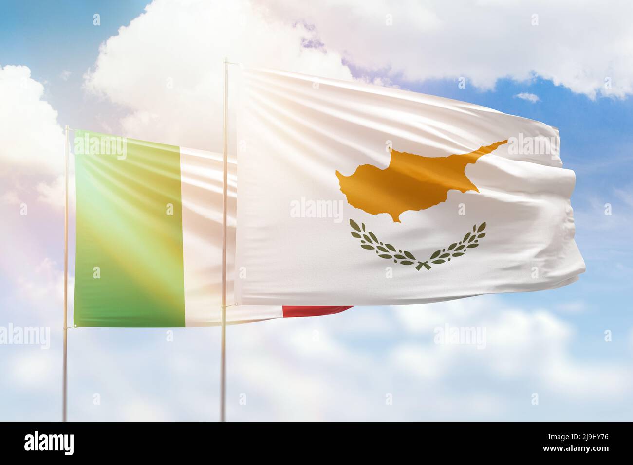 Sunny blue sky and flags of cyprus and italy Stock Photo - Alamy