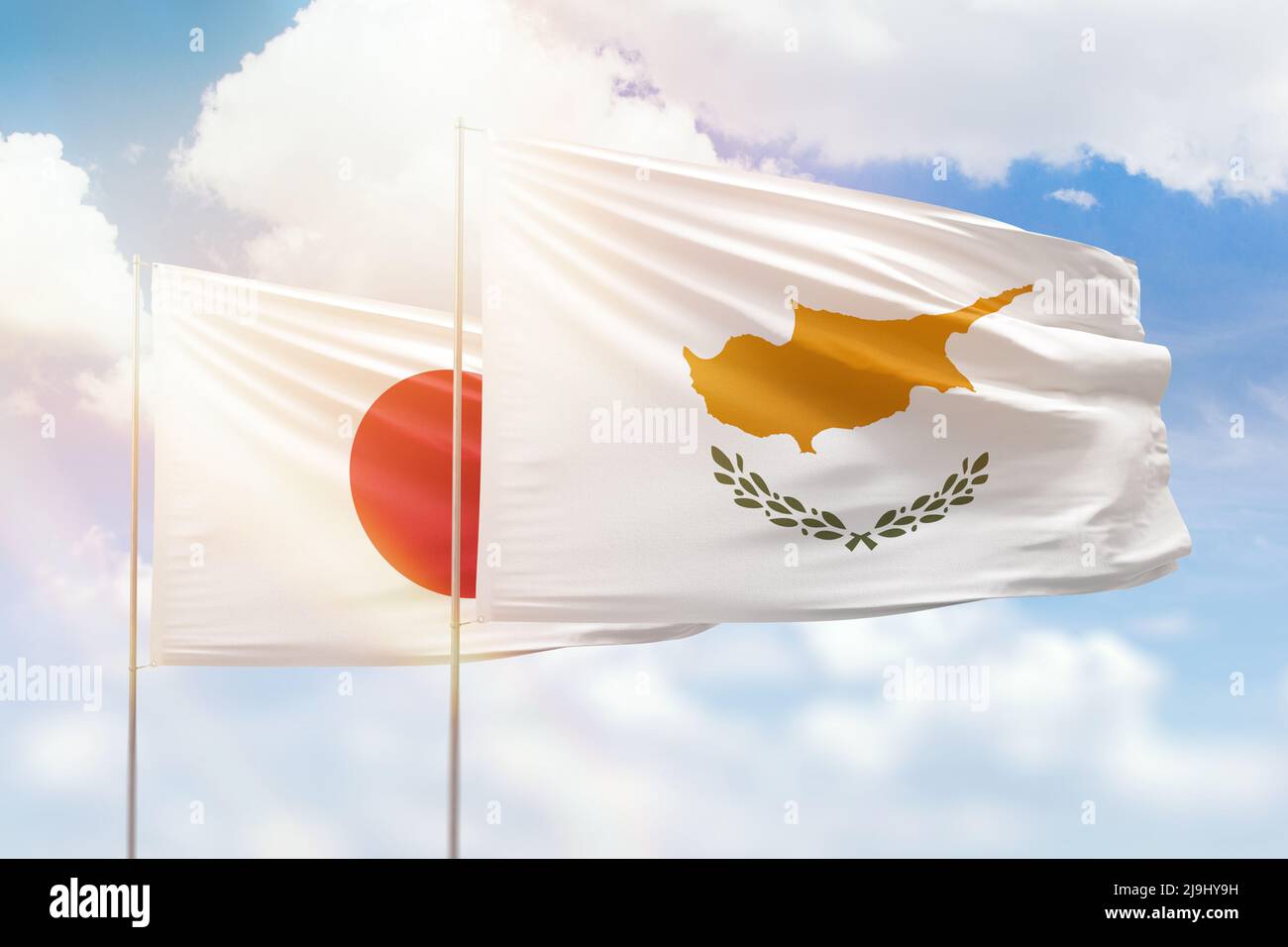 Sunny blue sky and flags of cyprus and japan Stock Photo - Alamy