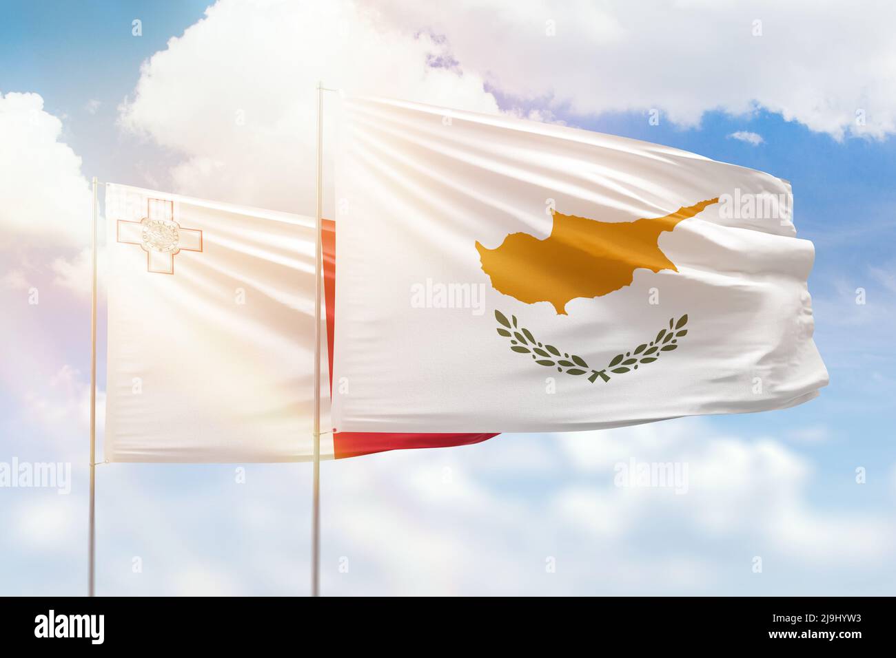 Sunny blue sky and flags of cyprus and malta Stock Photo - Alamy