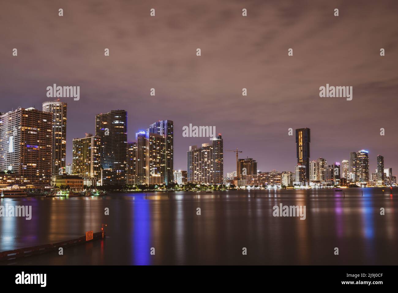 Miami Florida, sunset panorama with colorful illuminated business and ...