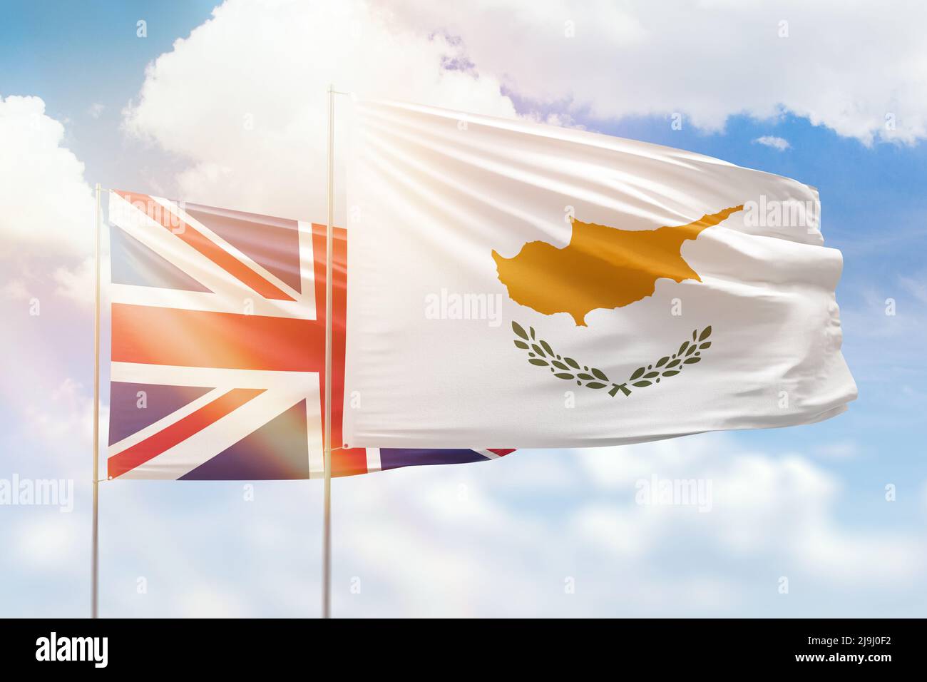 Sunny blue sky and flags of cyprus and united kingdom Stock Photo - Alamy