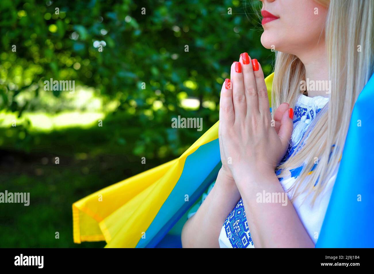 Close up of woman's hands praying for Ukraine Stock Photo - Alamy