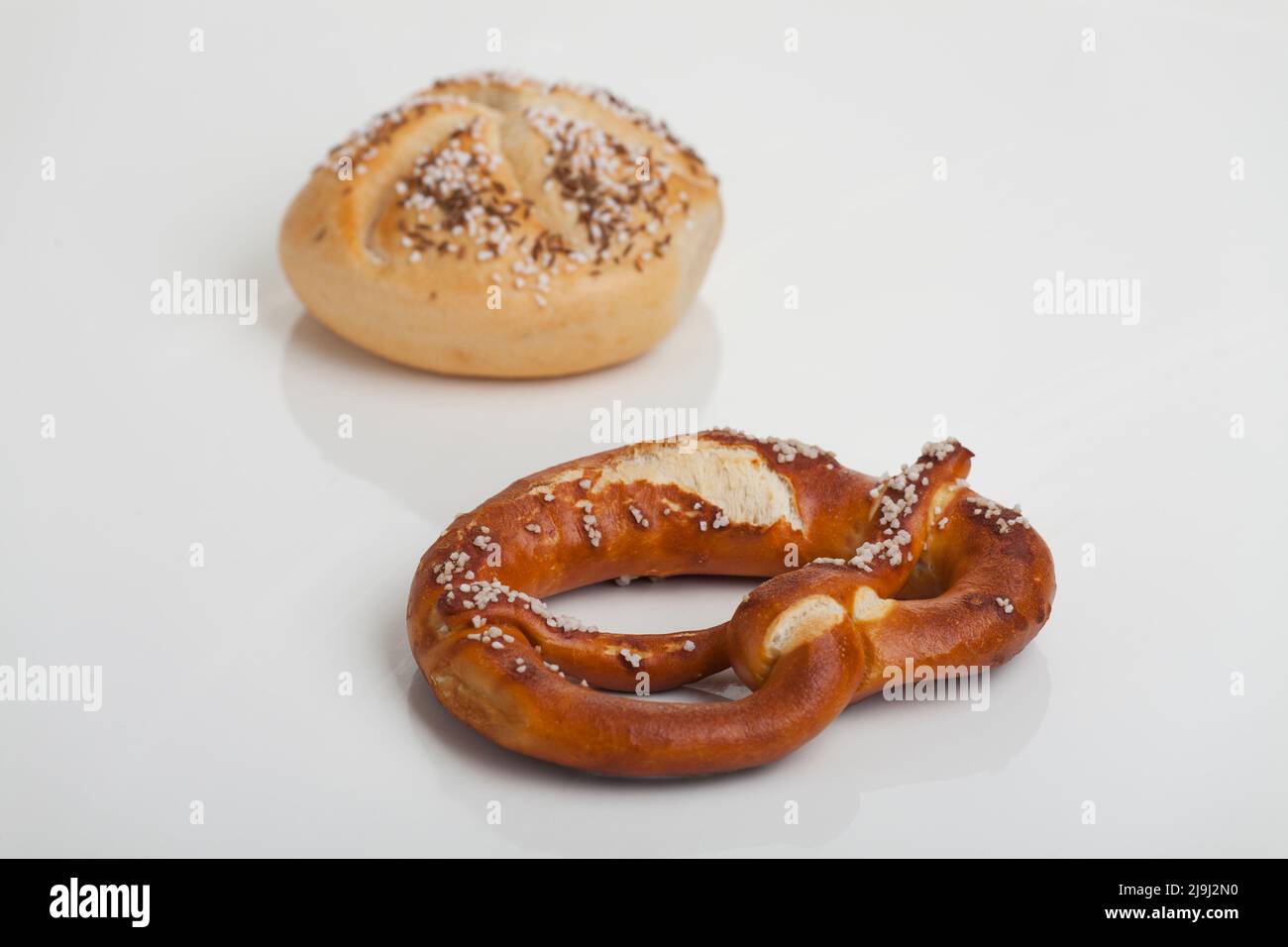 bavarian prezel with salt on white background Stock Photo - Alamy