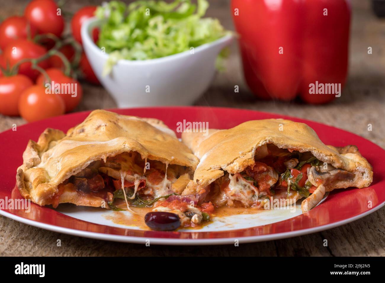 Pizza calzone with chicken and pepper hi-res stock photography and ...