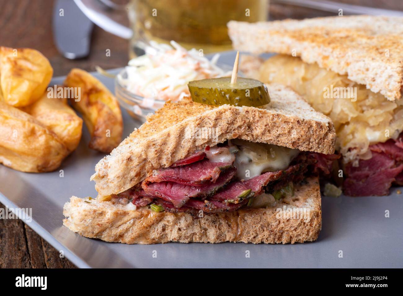 Reuben sandwich on a plate with fries hi-res stock photography and ...