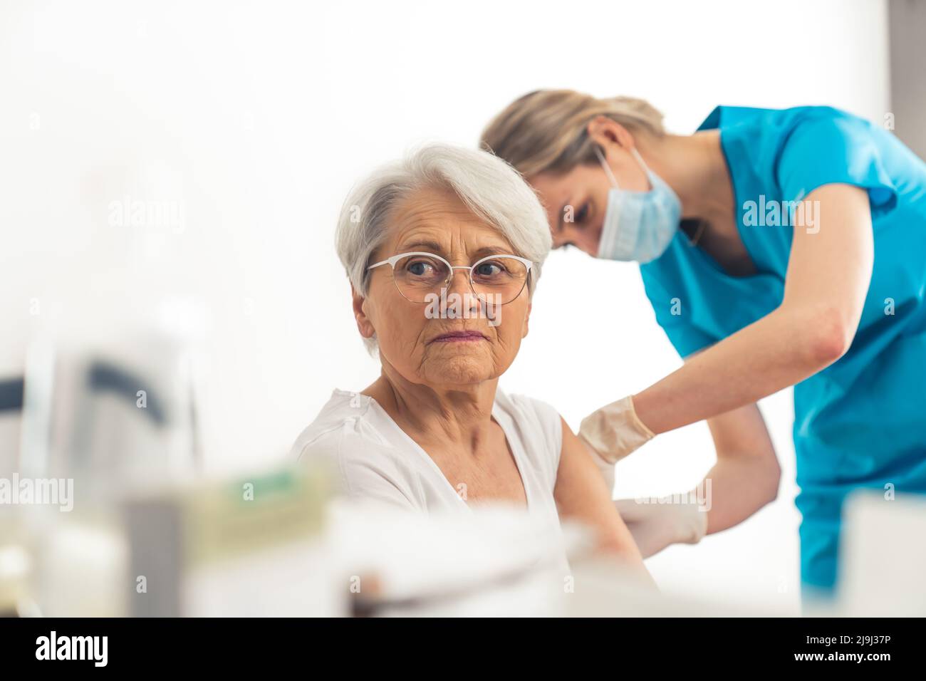 Inner shot of a scared woman in her 70s in eyeglasses during a ...