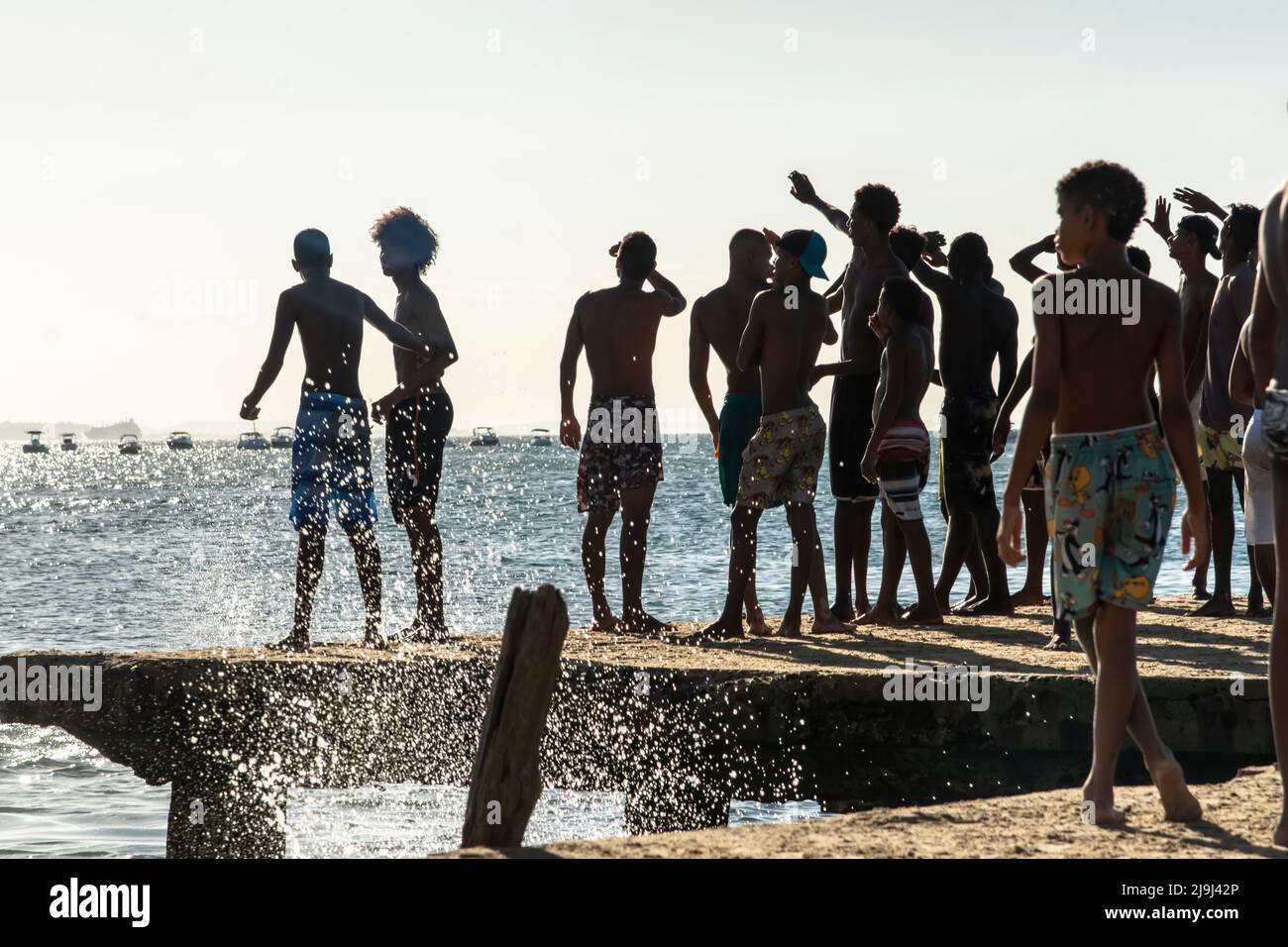 People at Ribeira beach in Salvador Bahia, having fun in the water ...