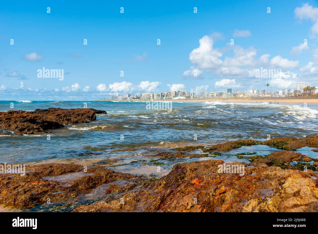 Beach and city landscape with buildings. Boca do Rio Beach in Salvador ...