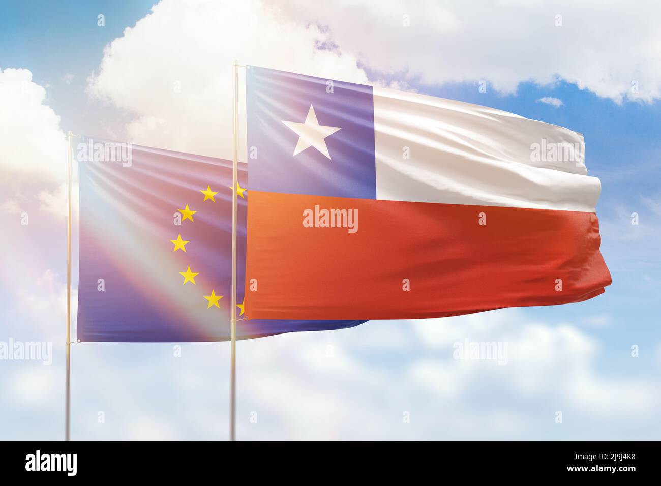 Sunny blue sky and flags of chile and european union Stock Photo - Alamy
