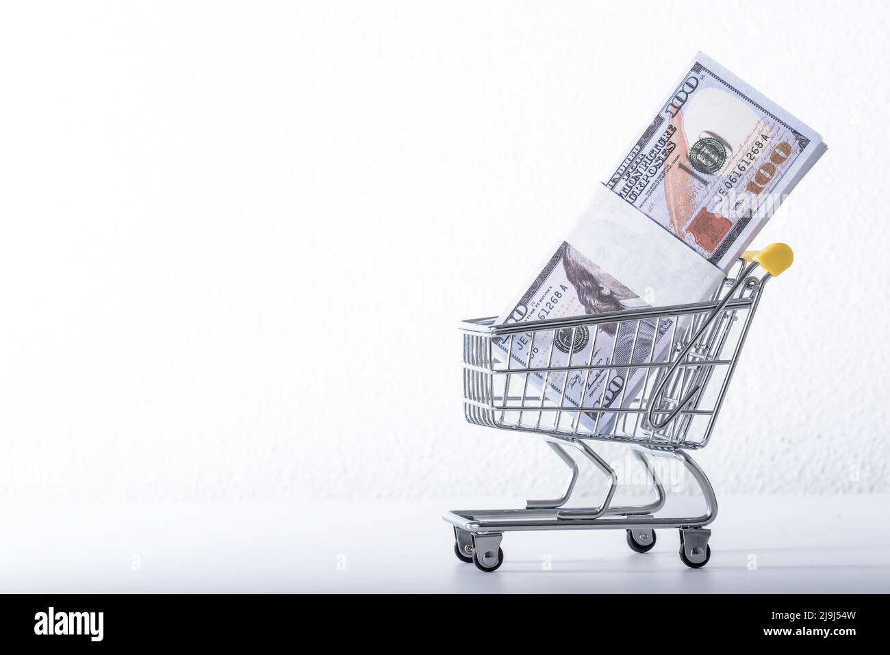 Money trolley. Grocery cart full of money Stock Photo - Alamy