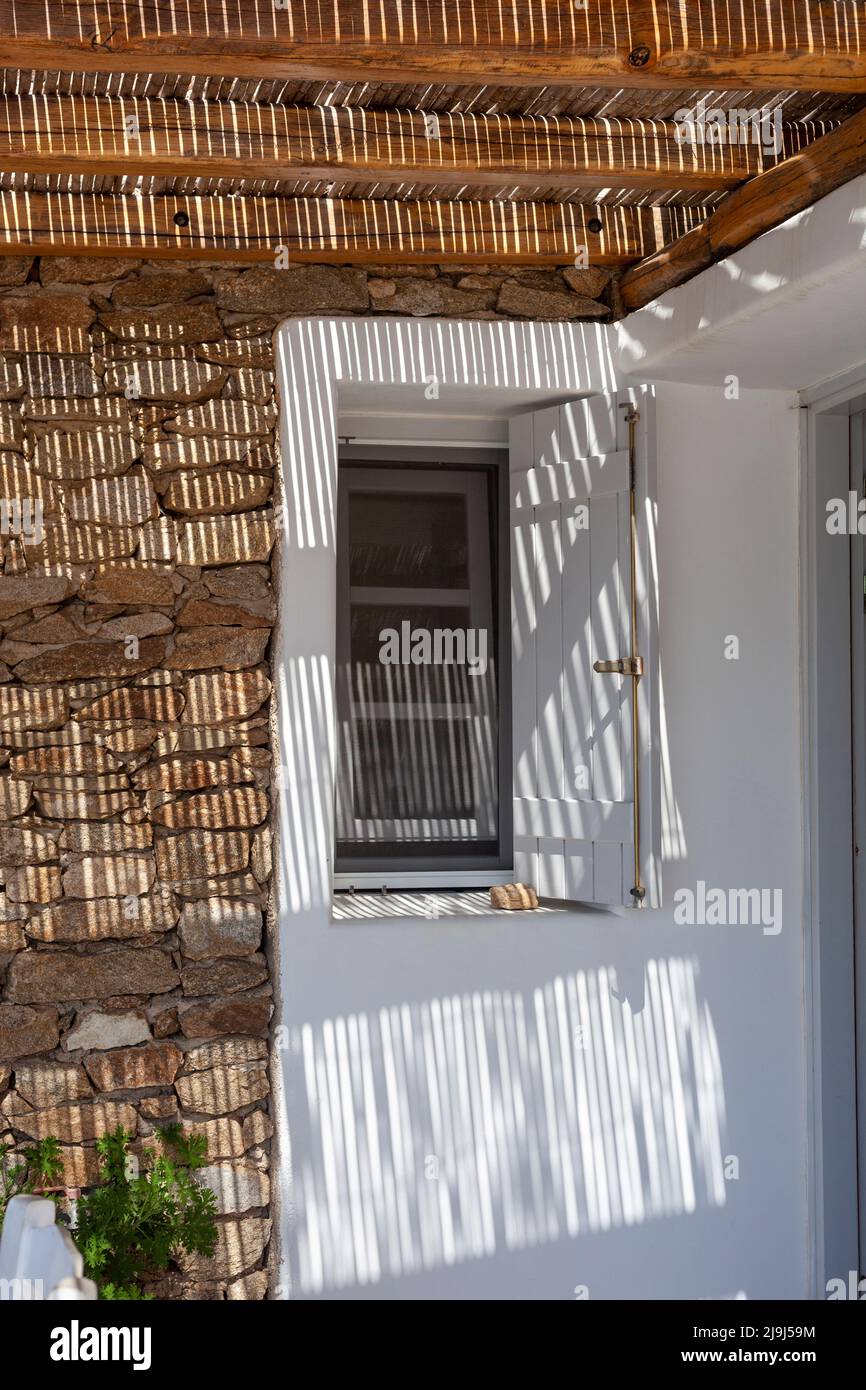 Sunlight shadow through the wooden roof of a stone villa Stock Photo ...