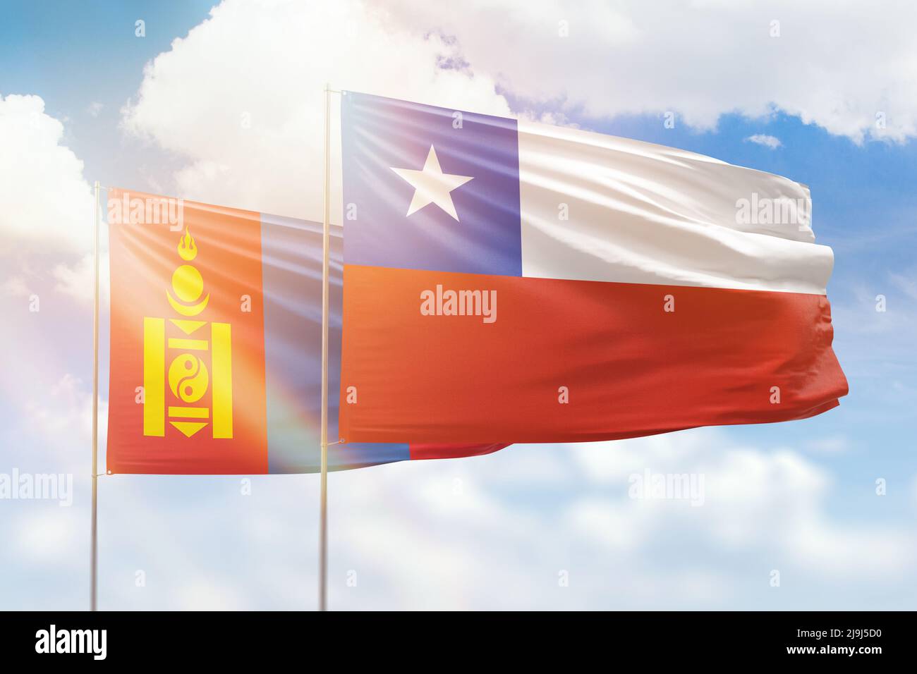 Sunny blue sky and flags of chile and mongolia Stock Photo - Alamy