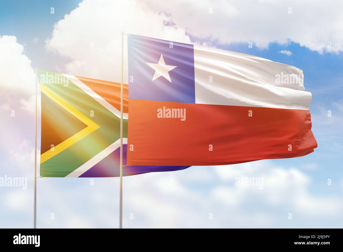 Sunny blue sky and flags of chile and south africa Stock Photo - Alamy
