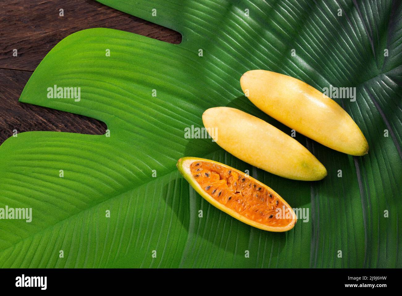 Exotic tropical organic curuba - Passiflora tripartita Stock Photo - Alamy