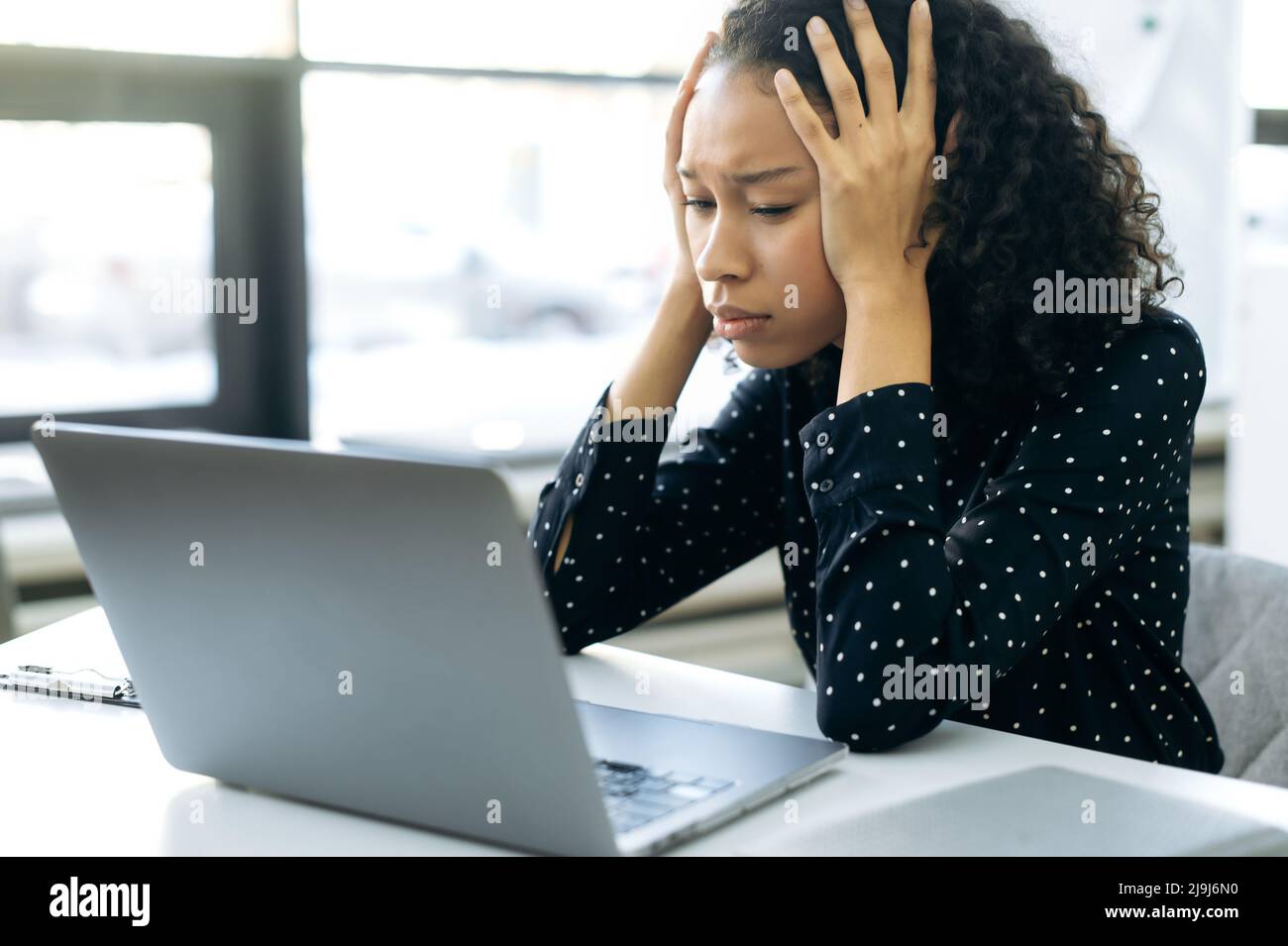 Exhausted African American woman, auditor, lawyer, economist, sits in ...