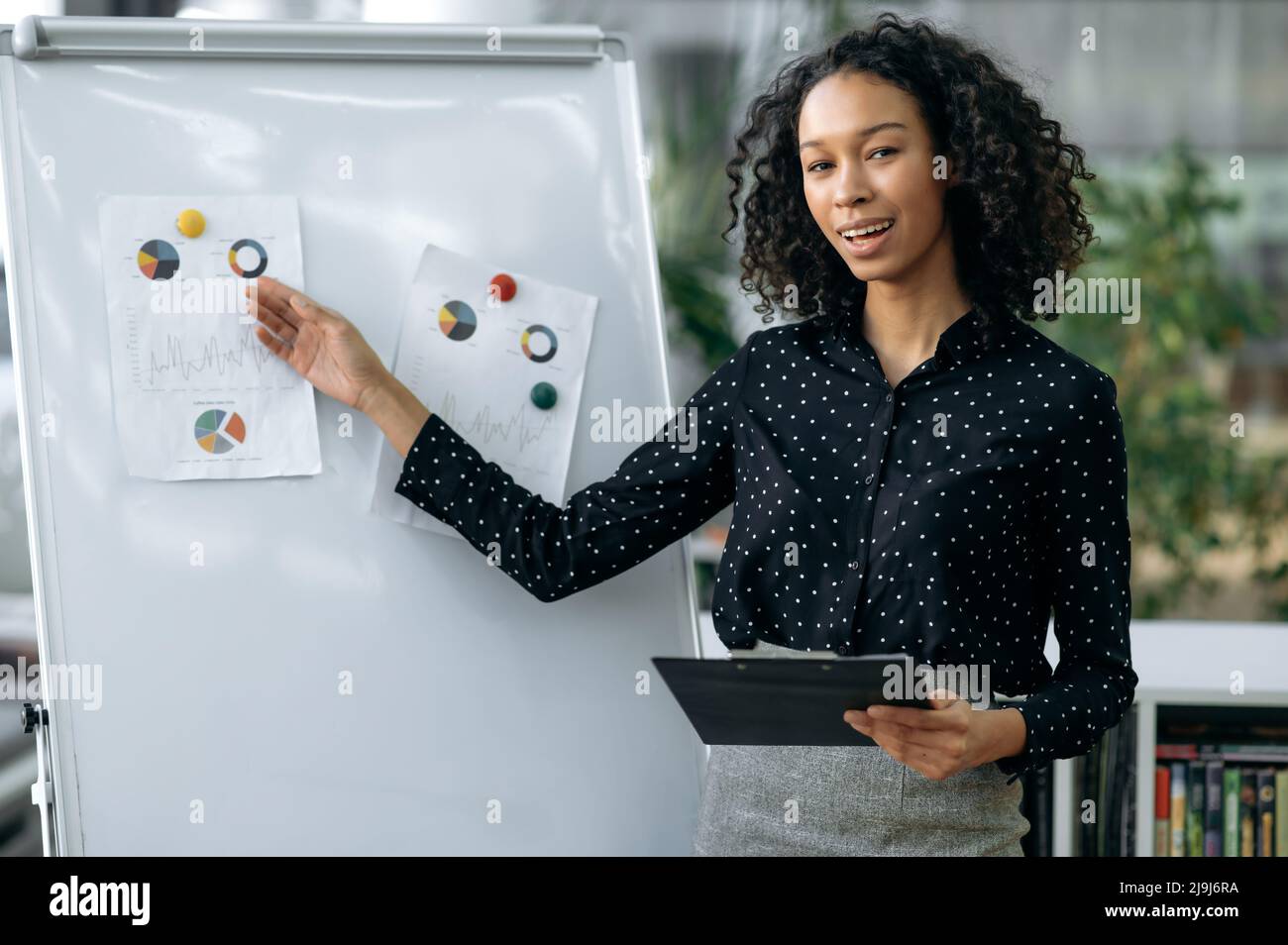 Intelligent young adult African American woman, financial analyst ...