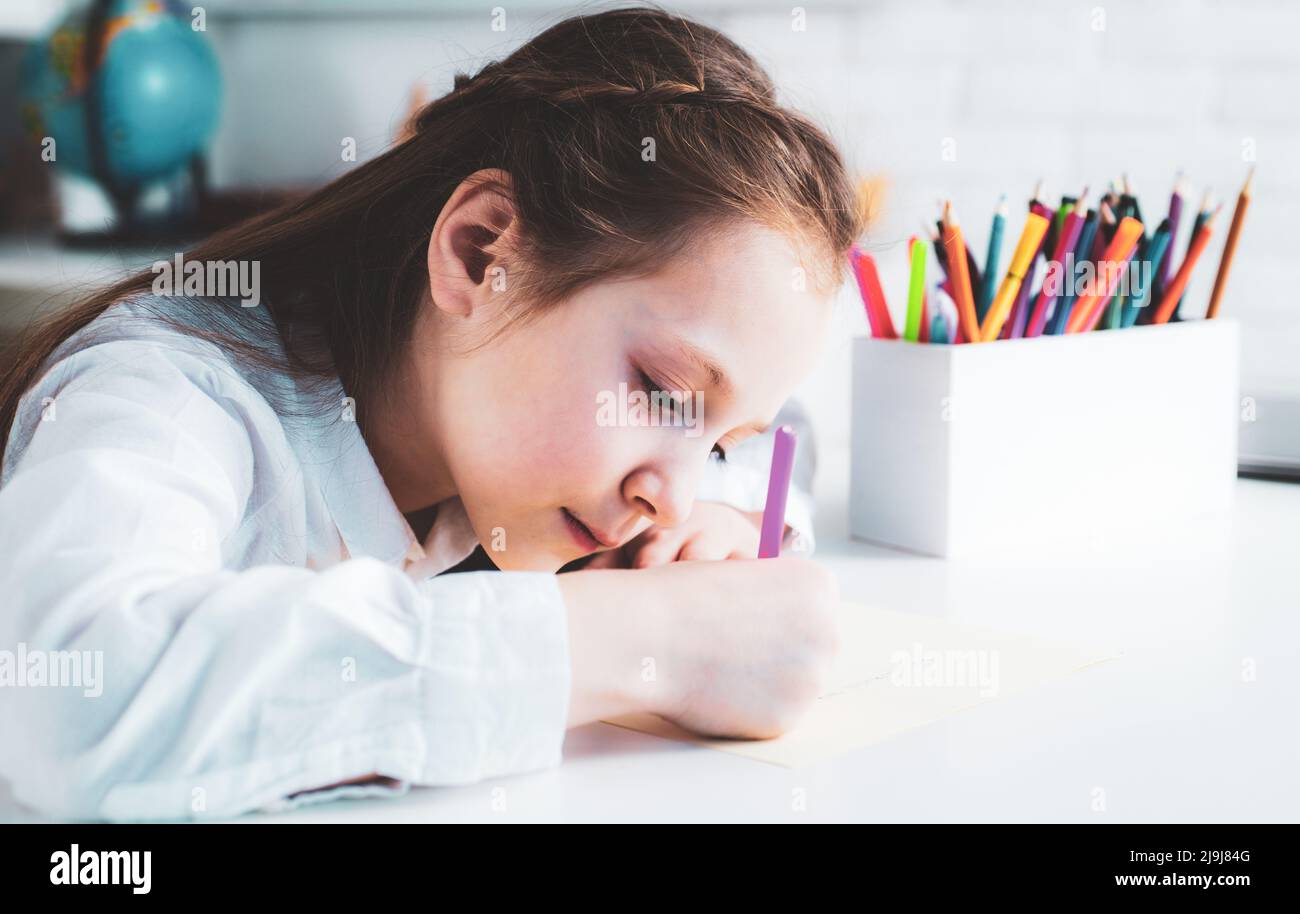 Happy cheerful child girl drawing. Creativity concept. Cute child ...