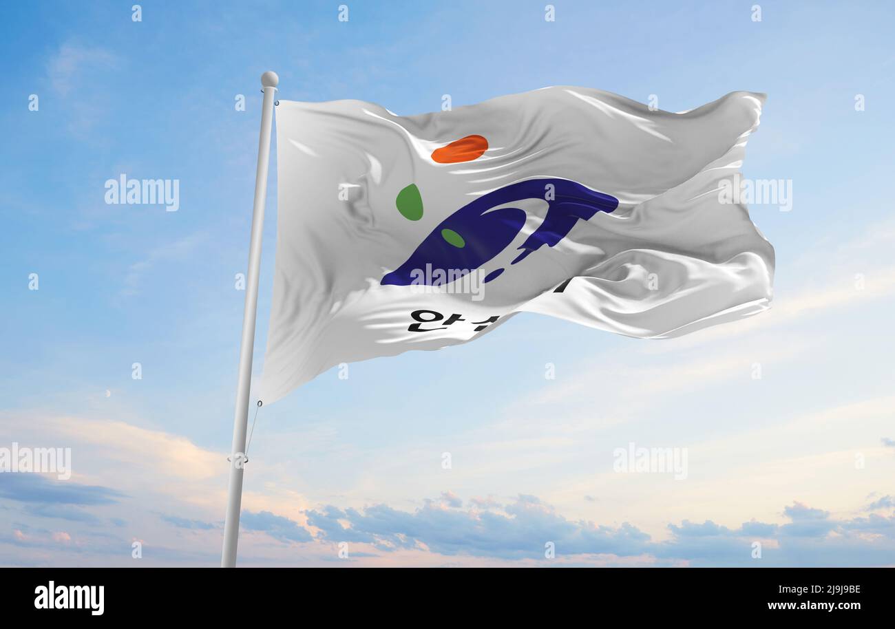official flag of Ansan city, South Korea at cloudy sky background on ...