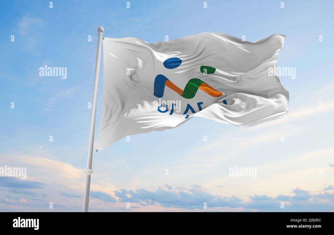 official flag of Asan city, South Korea at cloudy sky background on ...