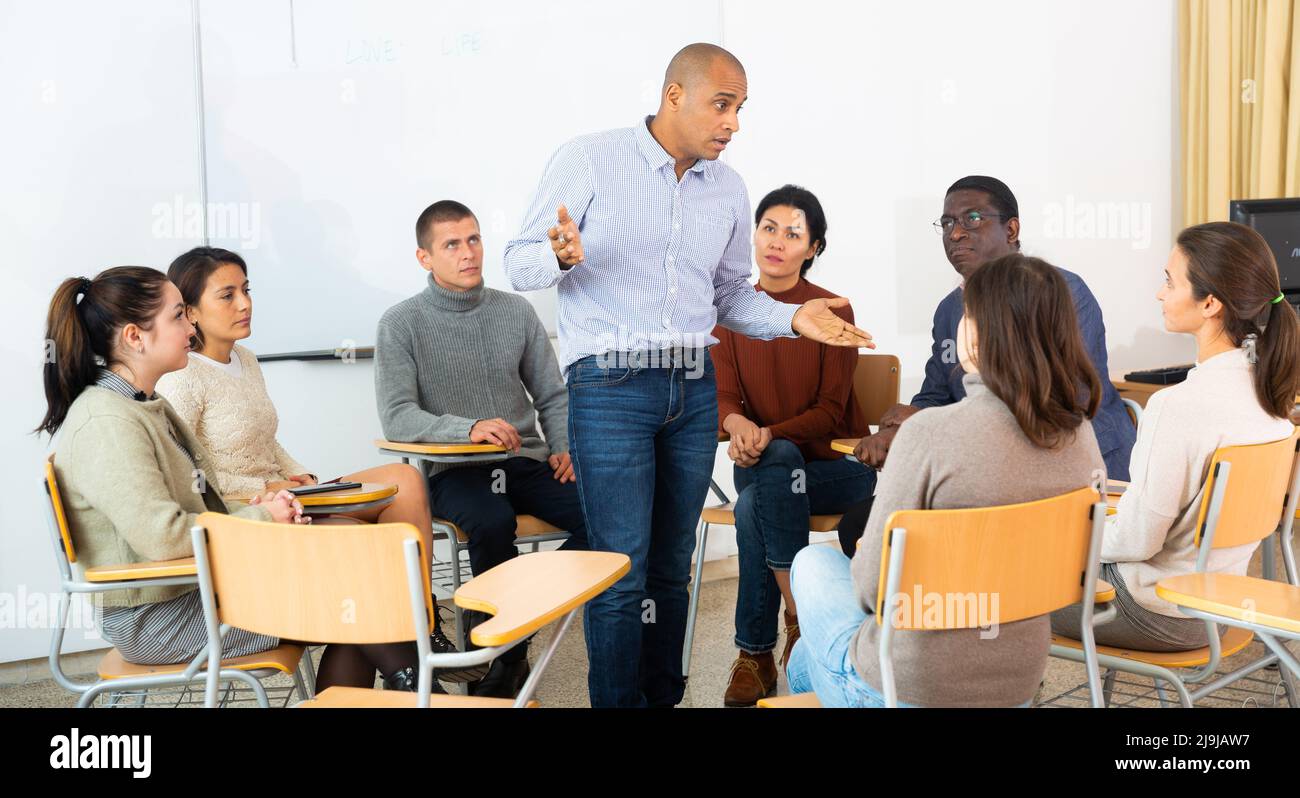 Teacher conducts refresher course for employees Stock Photo - Alamy