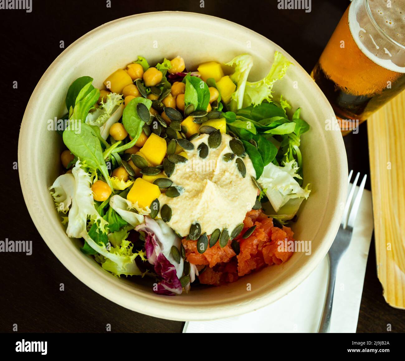 Fish salad with hummus and salmon Stock Photo - Alamy