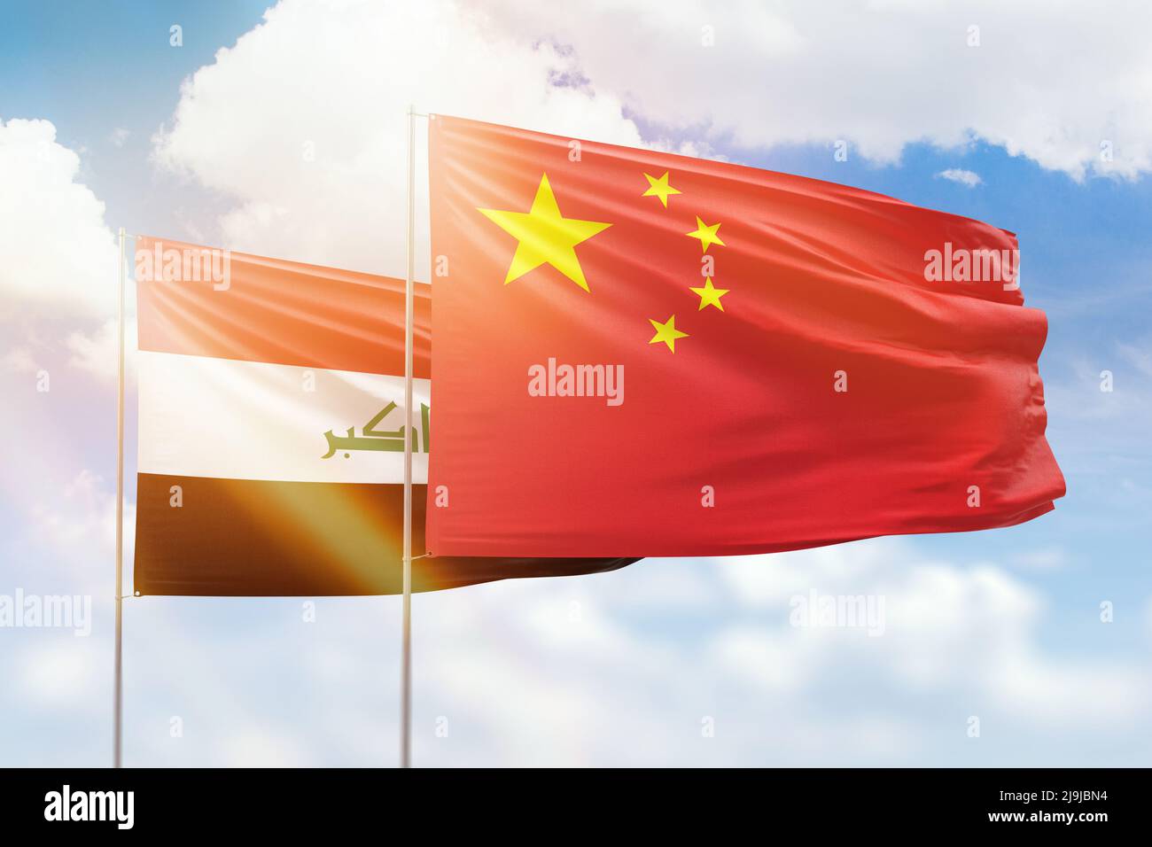 Sunny blue sky and flags of china and iraq Stock Photo - Alamy