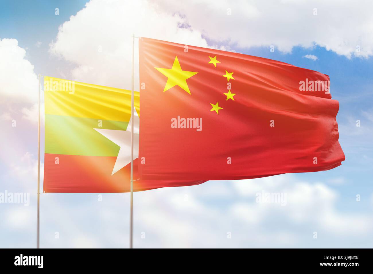 Sunny blue sky and flags of china and myanmar Stock Photo - Alamy