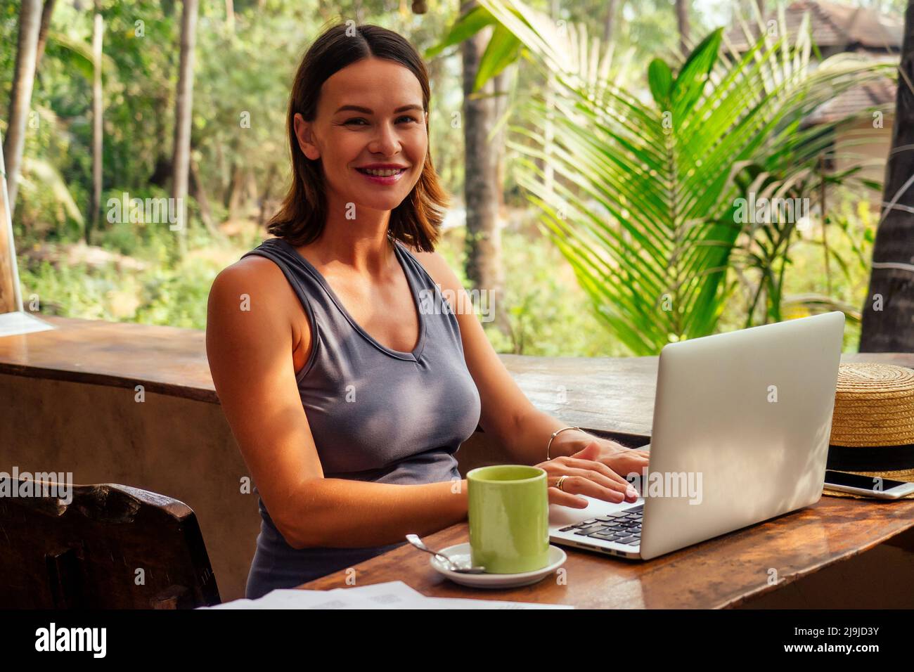 Woman tropical drink computer hi-res stock photography and images - Alamy
