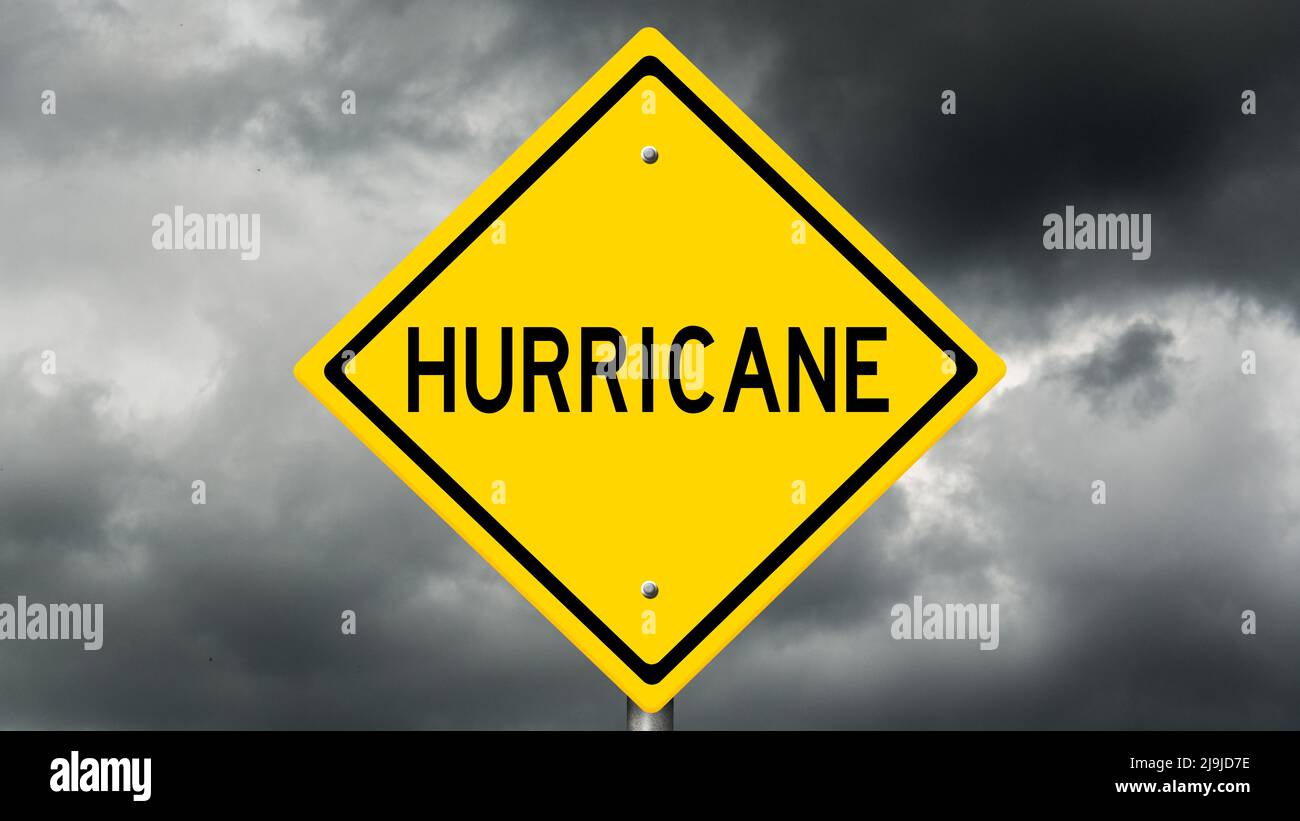Yellow warning sign for hurricane Stock Photo - Alamy