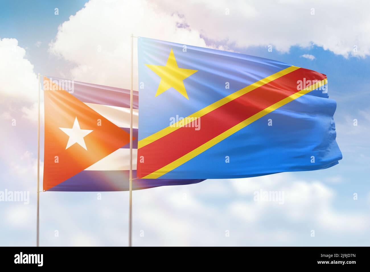 Sunny blue sky and flags of dr congo and cuba Stock Photo - Alamy