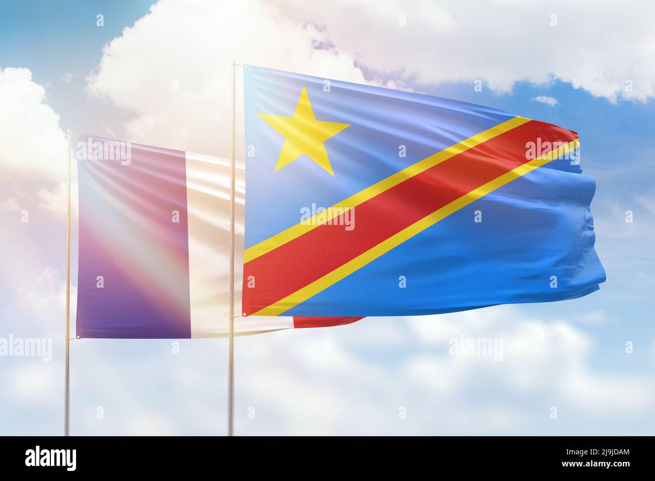 Sunny blue sky and flags of dr congo and france Stock Photo - Alamy