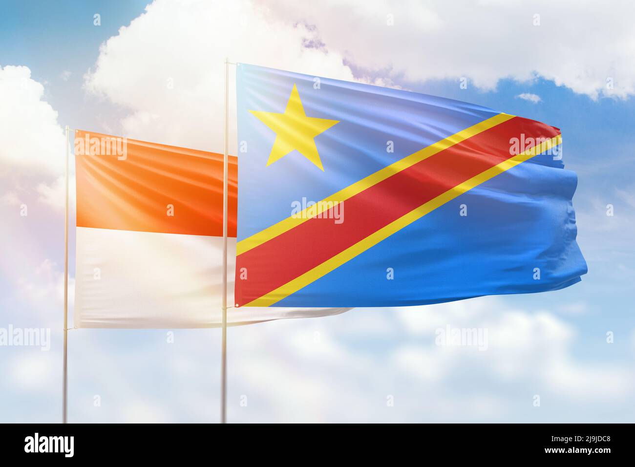 Sunny blue sky and flags of dr congo and indonesia Stock Photo - Alamy