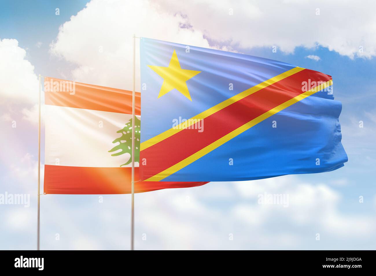 Sunny blue sky and flags of dr congo and lebanon Stock Photo - Alamy