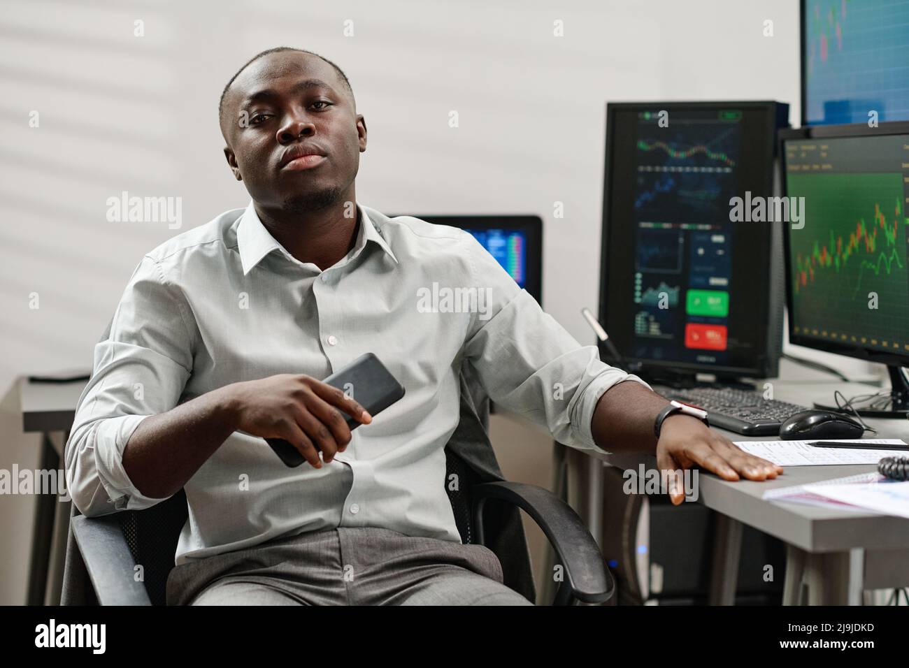 Dark Man Sitting In Office