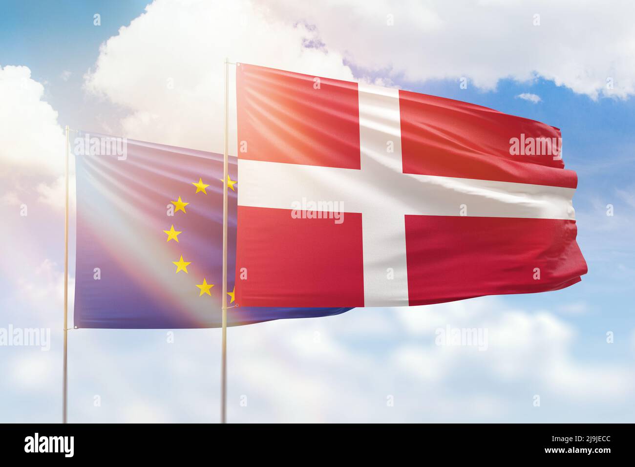 Sunny blue sky and flags of denmark and european union Stock Photo - Alamy