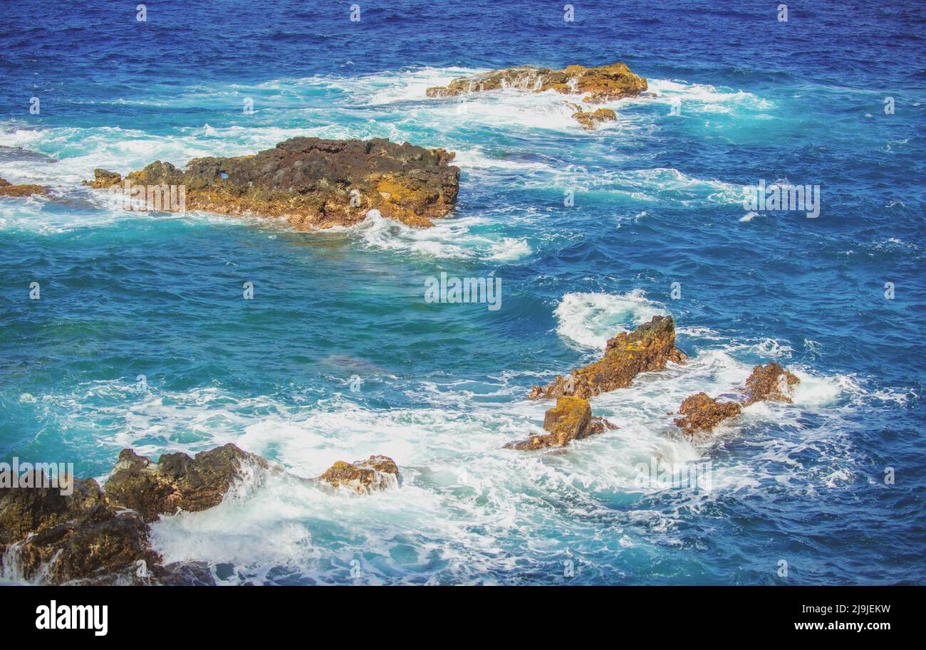 Splashing waves on the rock in the sea. Wave hit the stone in the ocean ...