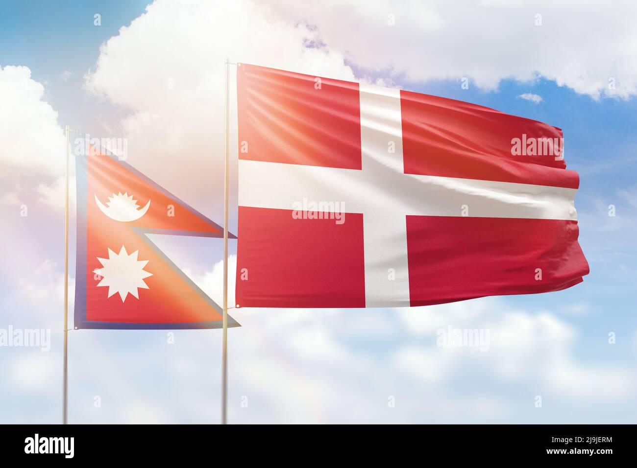 Sunny blue sky and flags of denmark and nepal Stock Photo - Alamy
