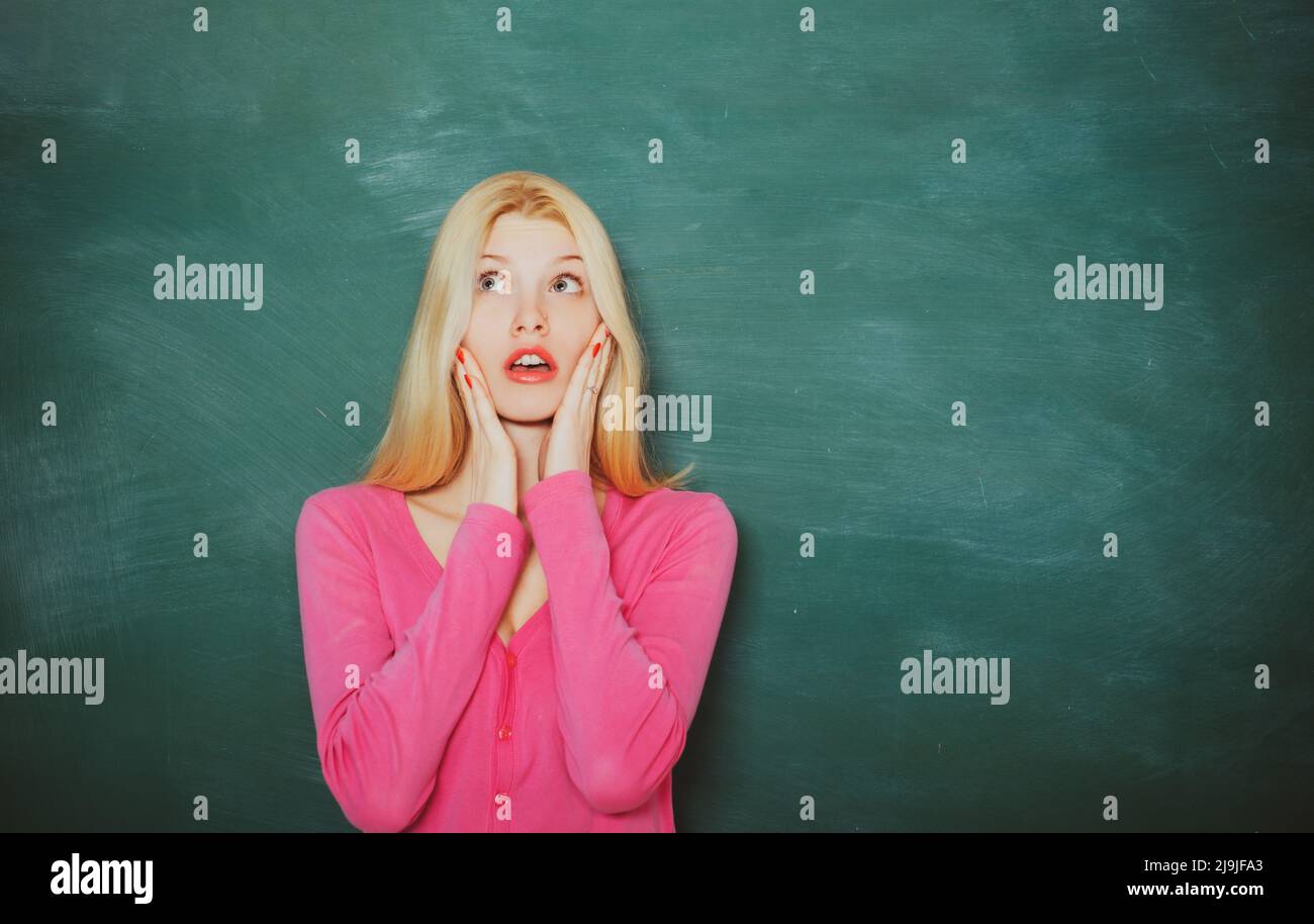 Modern attractive teacher. Portrait of smart young teacher with ...