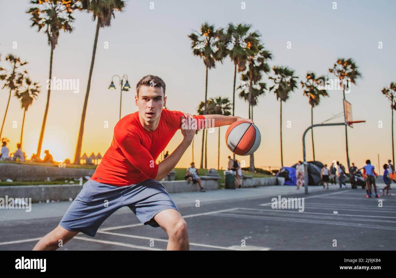 Basketball player. Sports and basketball. Man jumps and throws a ball ...