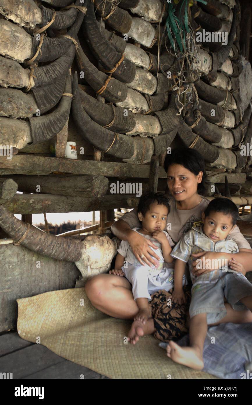 Portrait of a woman with her children as they are having a leisure time ...