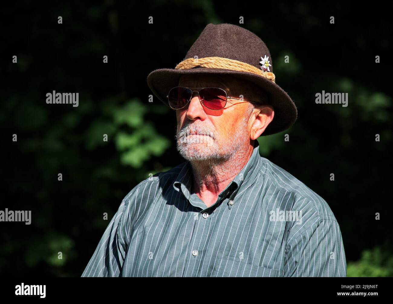 Portrait of senior man with hunting hat Stock Photo - Alamy
