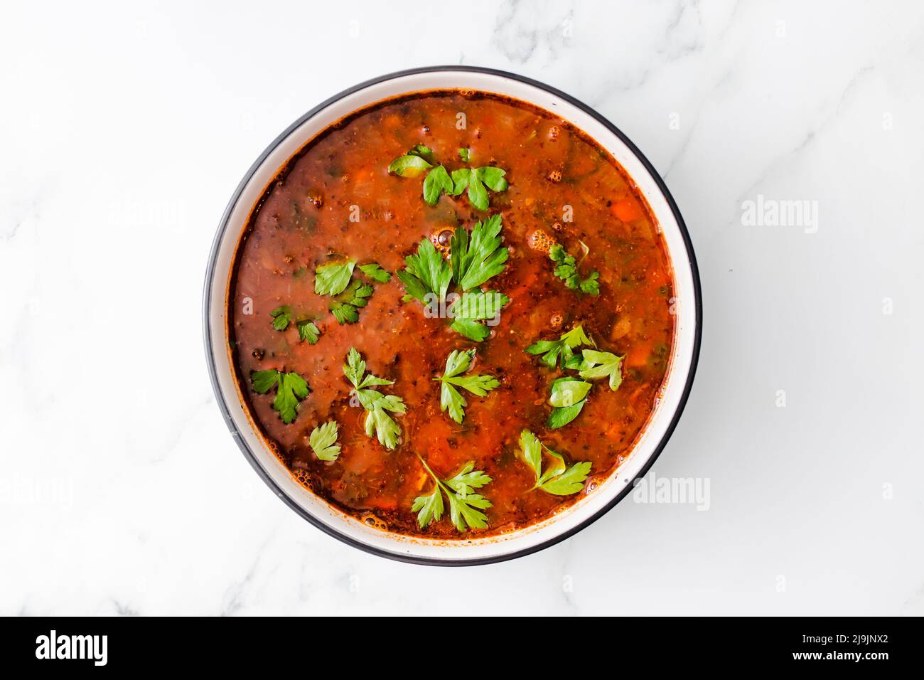 vegan mexican-inspired spicy tomato soup with red kidney beans corn and ...