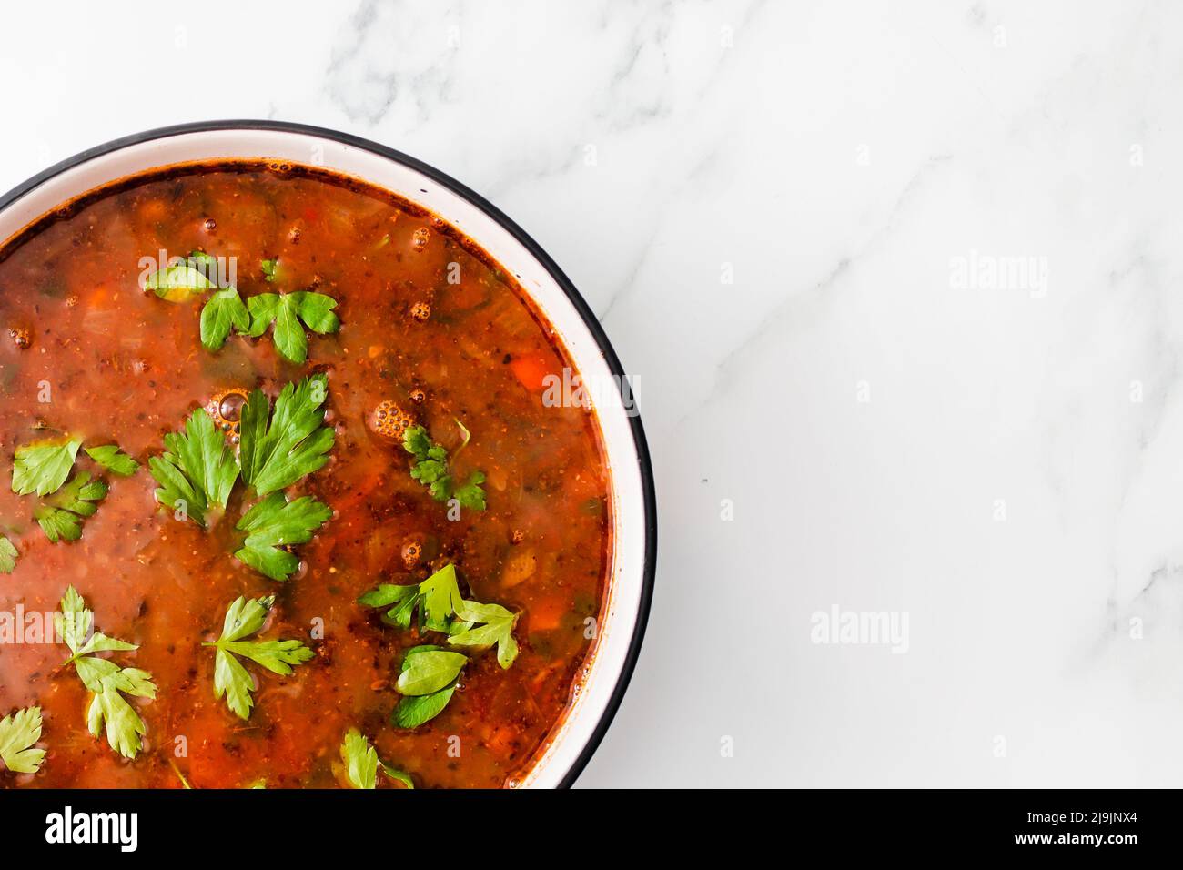 vegan mexican-inspired spicy tomato soup with red kidney beans corn and ...