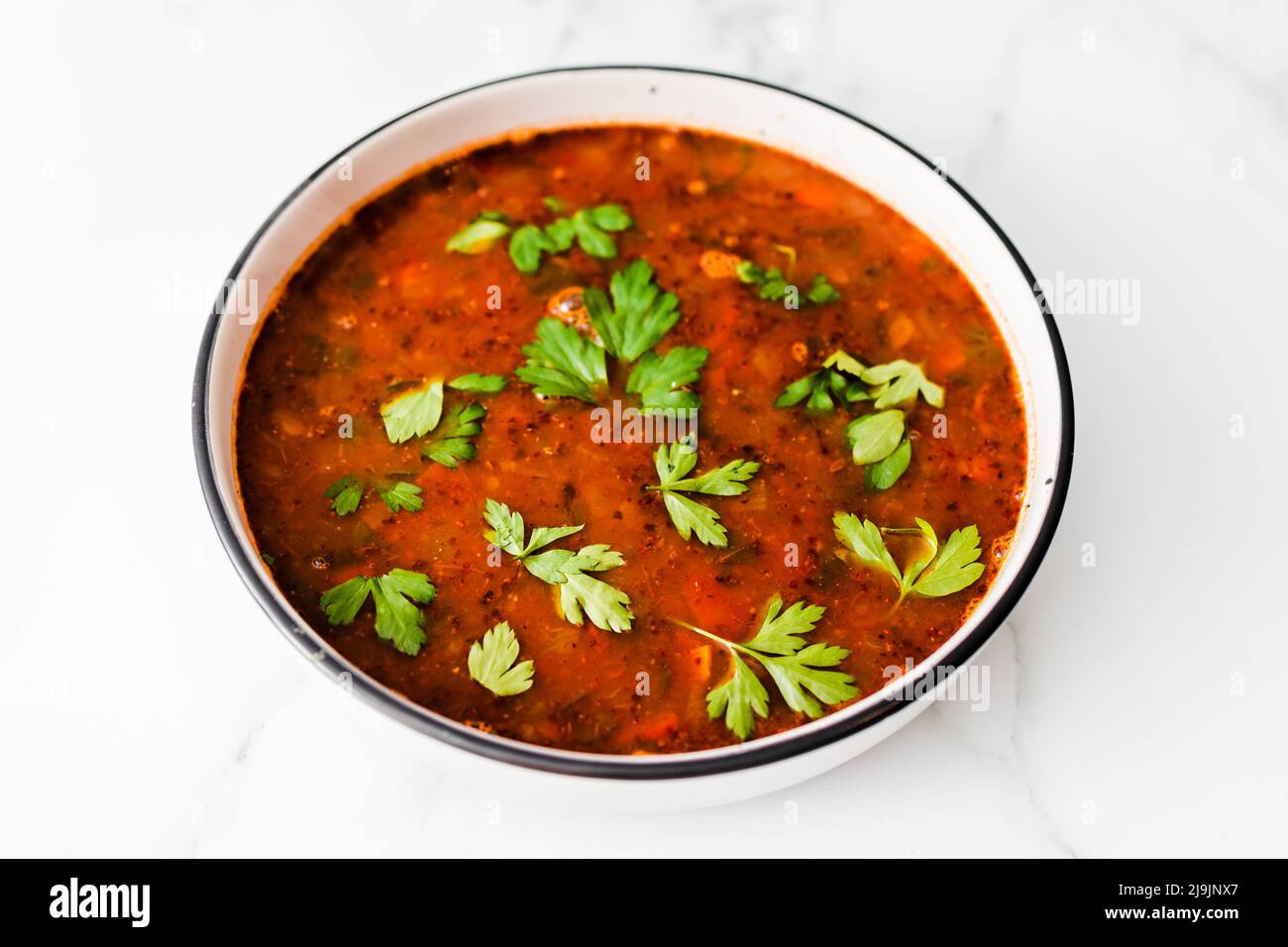 vegan mexican-inspired spicy tomato soup with red kidney beans corn and ...