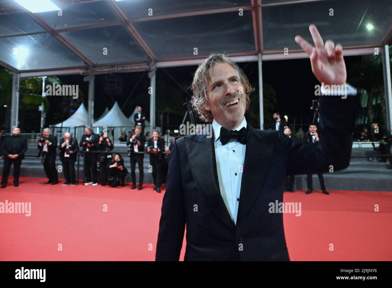 Cannes, France. May 23, 2022, Director Brett Morgen dances the carpet ...
