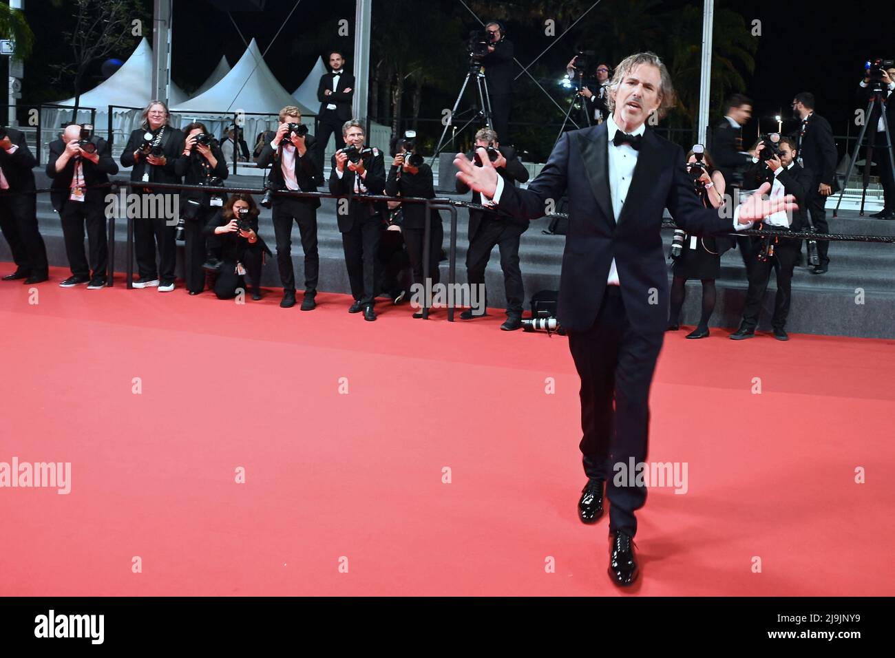 Cannes, France. May 23, 2022, Director Brett Morgen dances the carpet ...