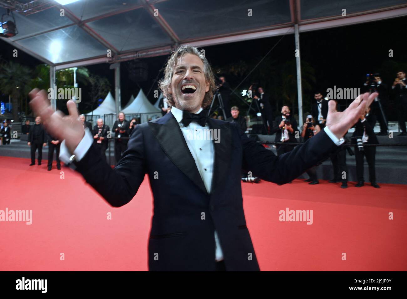 Cannes, France. May 23, 2022, Director Brett Morgen dances the carpet ...