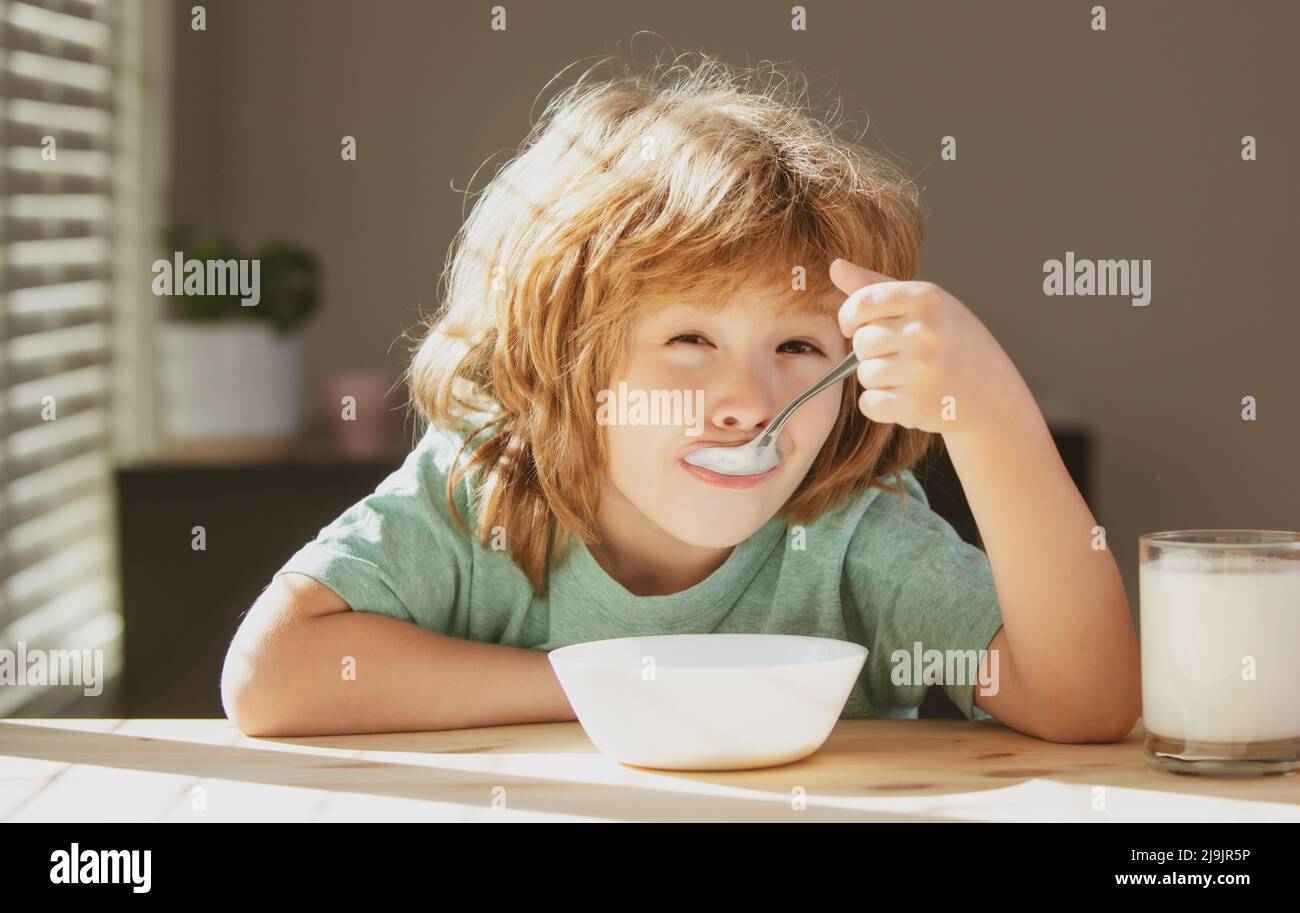 Child eat. Little healthy hungry boy eating soup from with spoon Stock ...